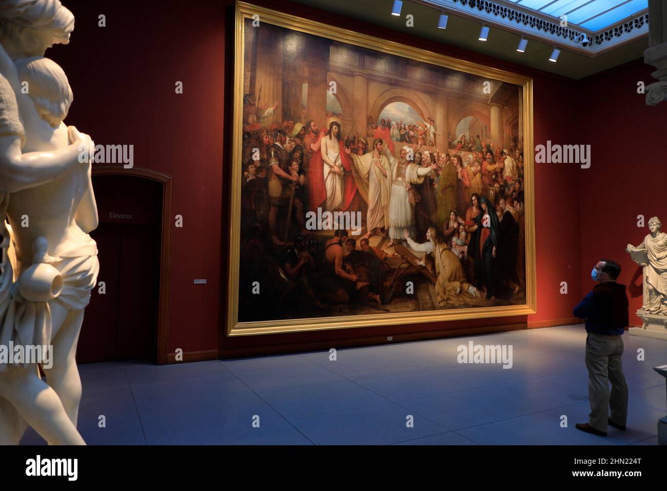 A visitor admiring the oil painting Christ Rejected (1814) by American ...