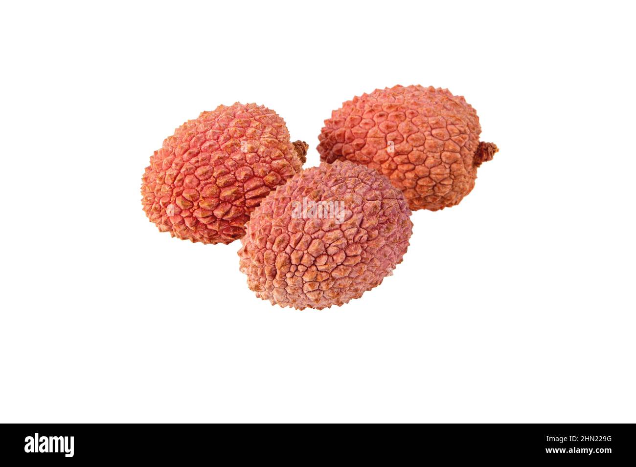 Three lychee fruits group closeup isolated on white. Litchi chinensis ...
