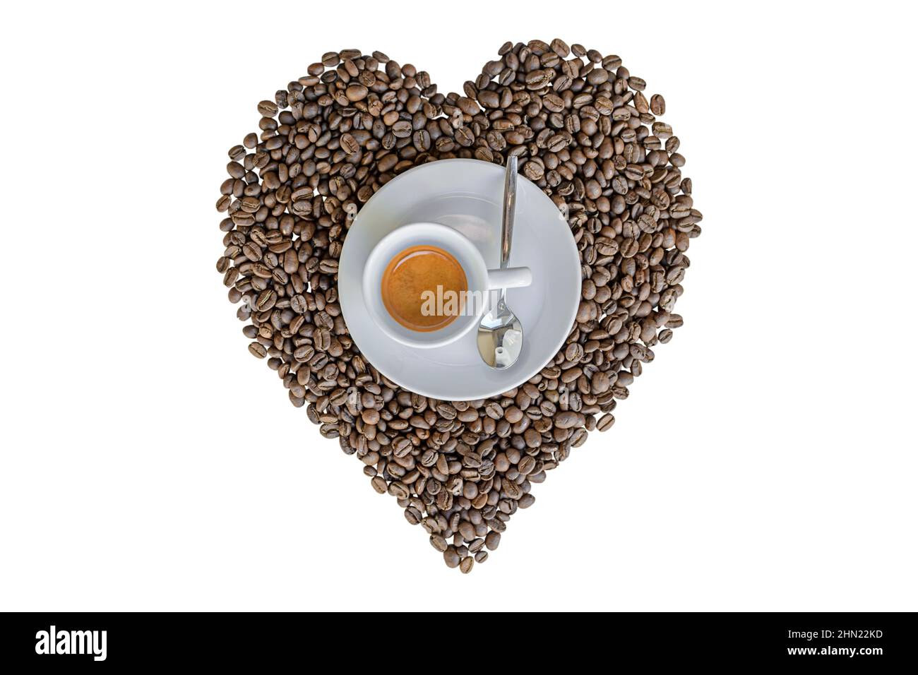 Cup of espresso coffee and coffee bean hart drawing on white table ...