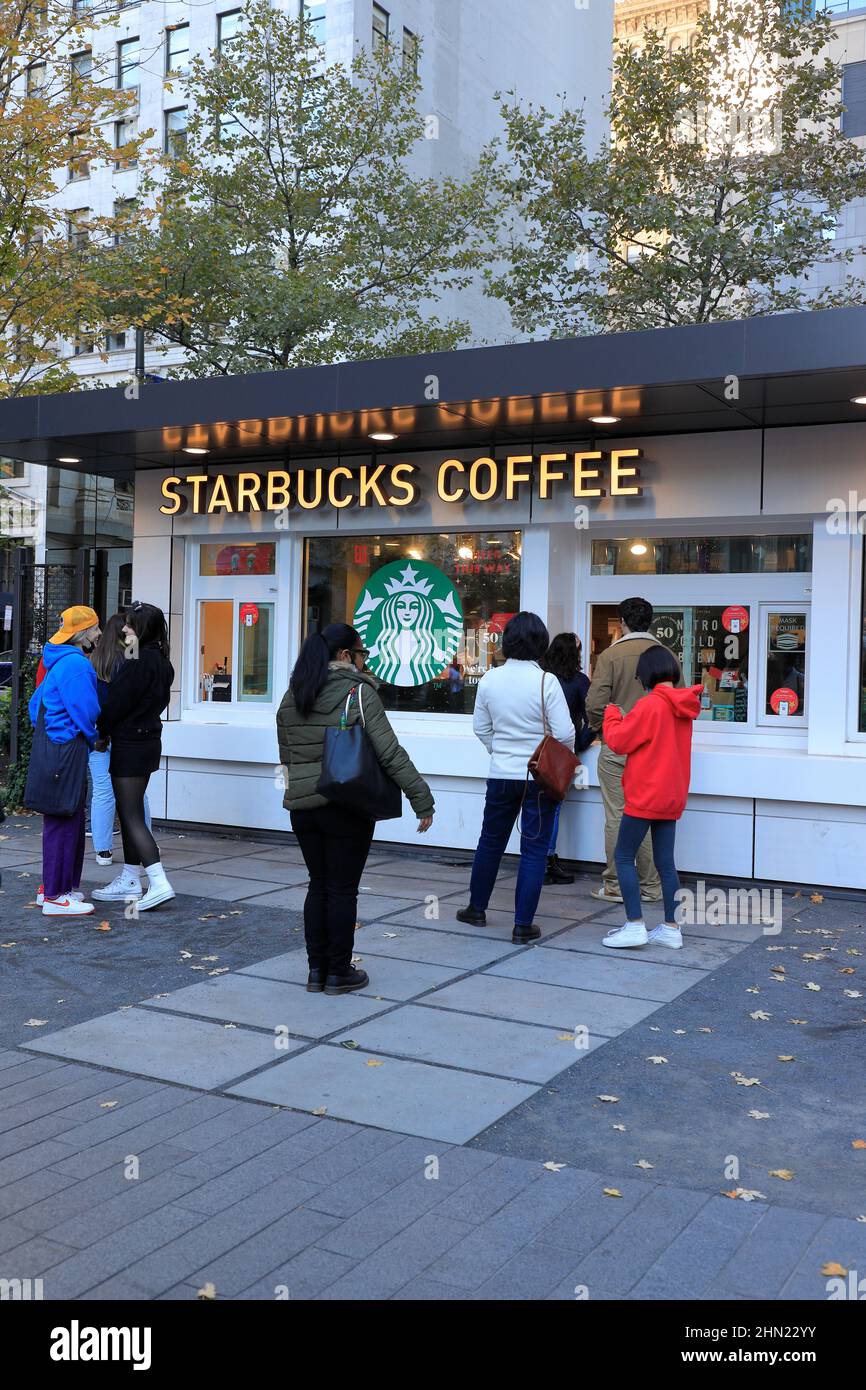 Customers waiting in line outside of a Starbucks Coffee in Dilworth ...