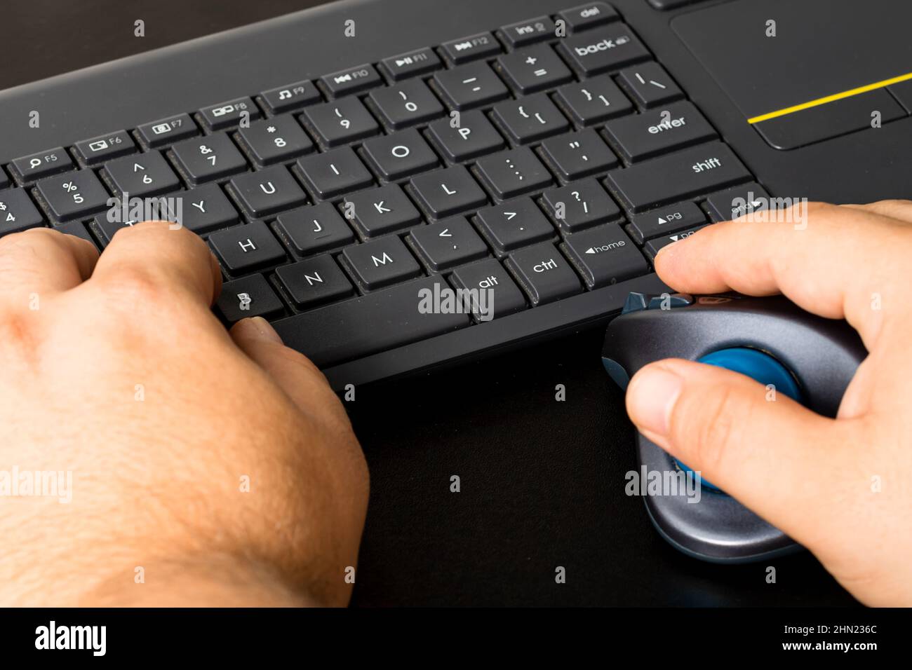 Hand using pc mouse and keyboard. Hand on computer mouse and keyboard ...