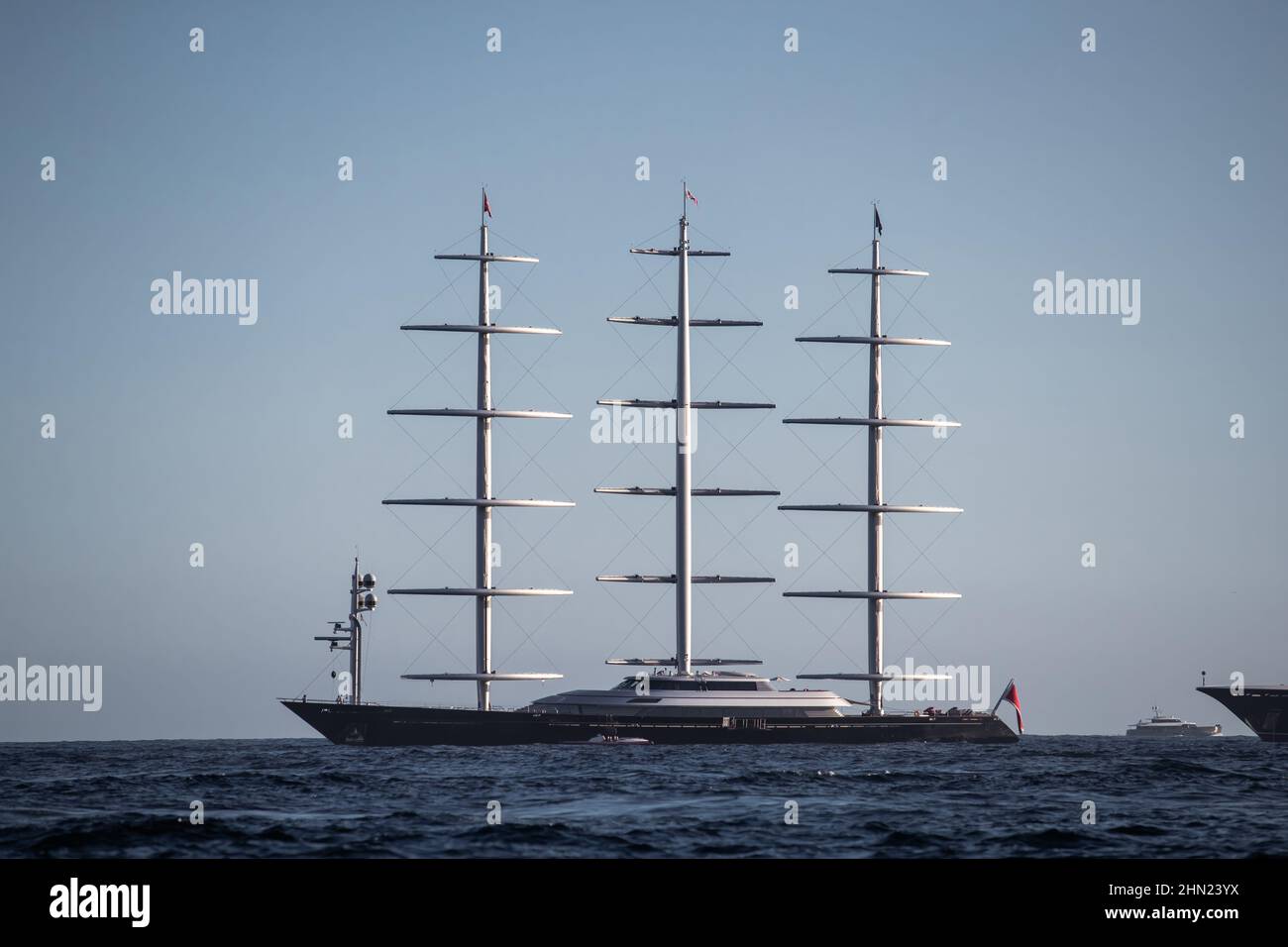 A huge sail yacht of conceptual design with three masts stands in the ...