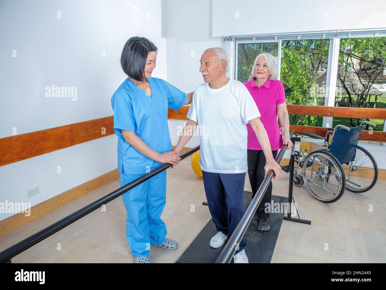 Elderly couple training gym helped hi-res stock photography and images ...