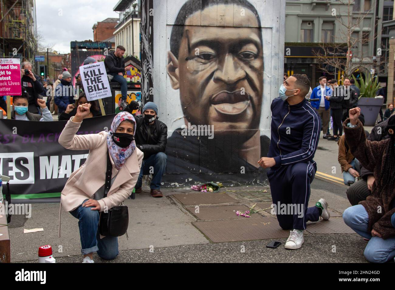 A group of british protesters on one knee Stock Photo - Alamy