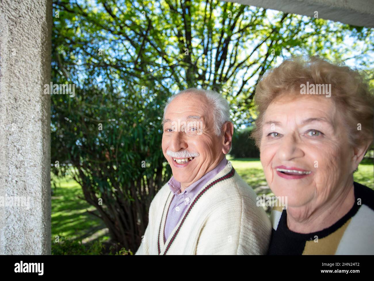 Happy couple of seniors smiling walking outdoor. Retired elderly people ...
