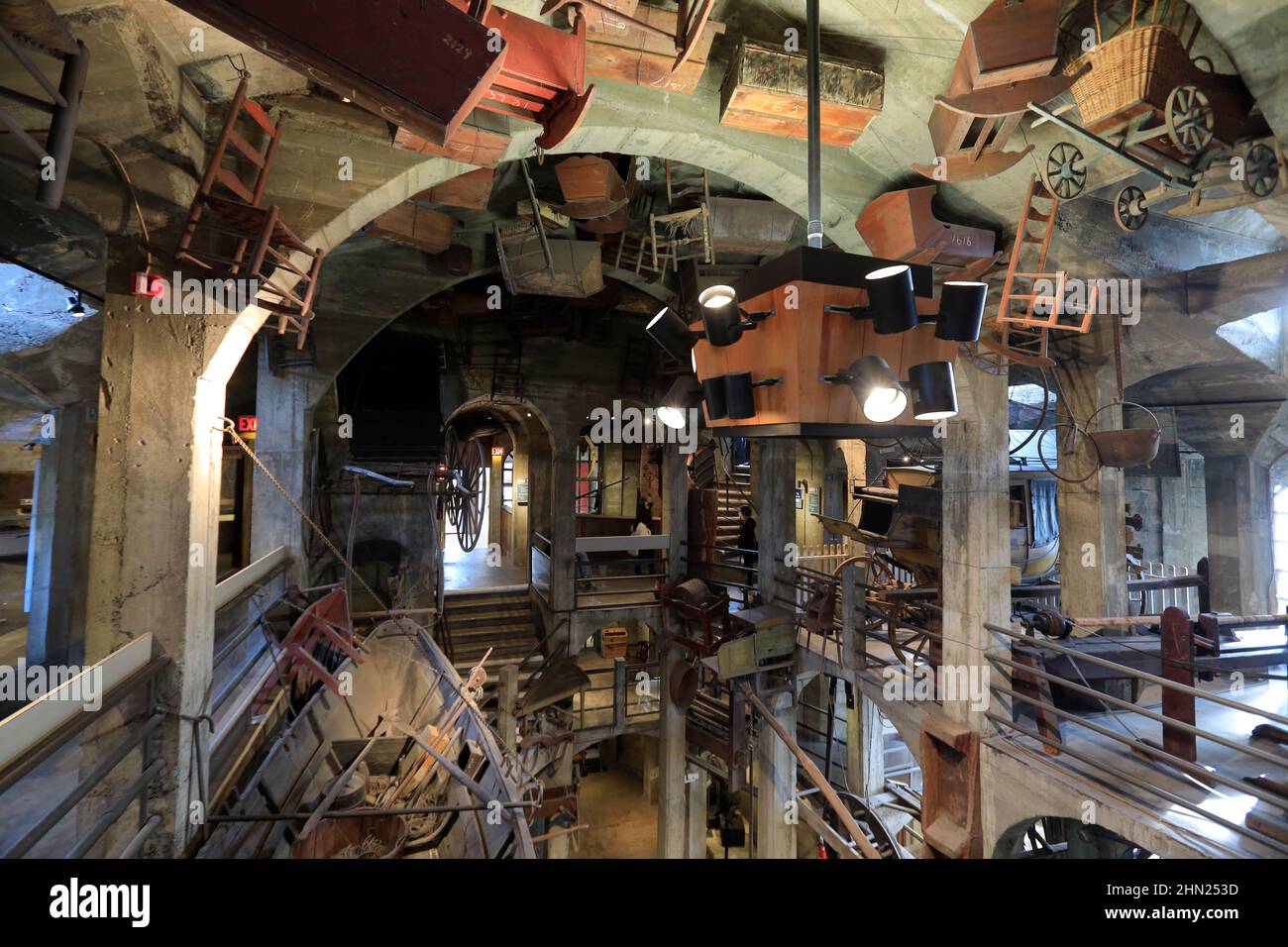 The interior view of Mercer Museum and Library with artifacts, tools ...