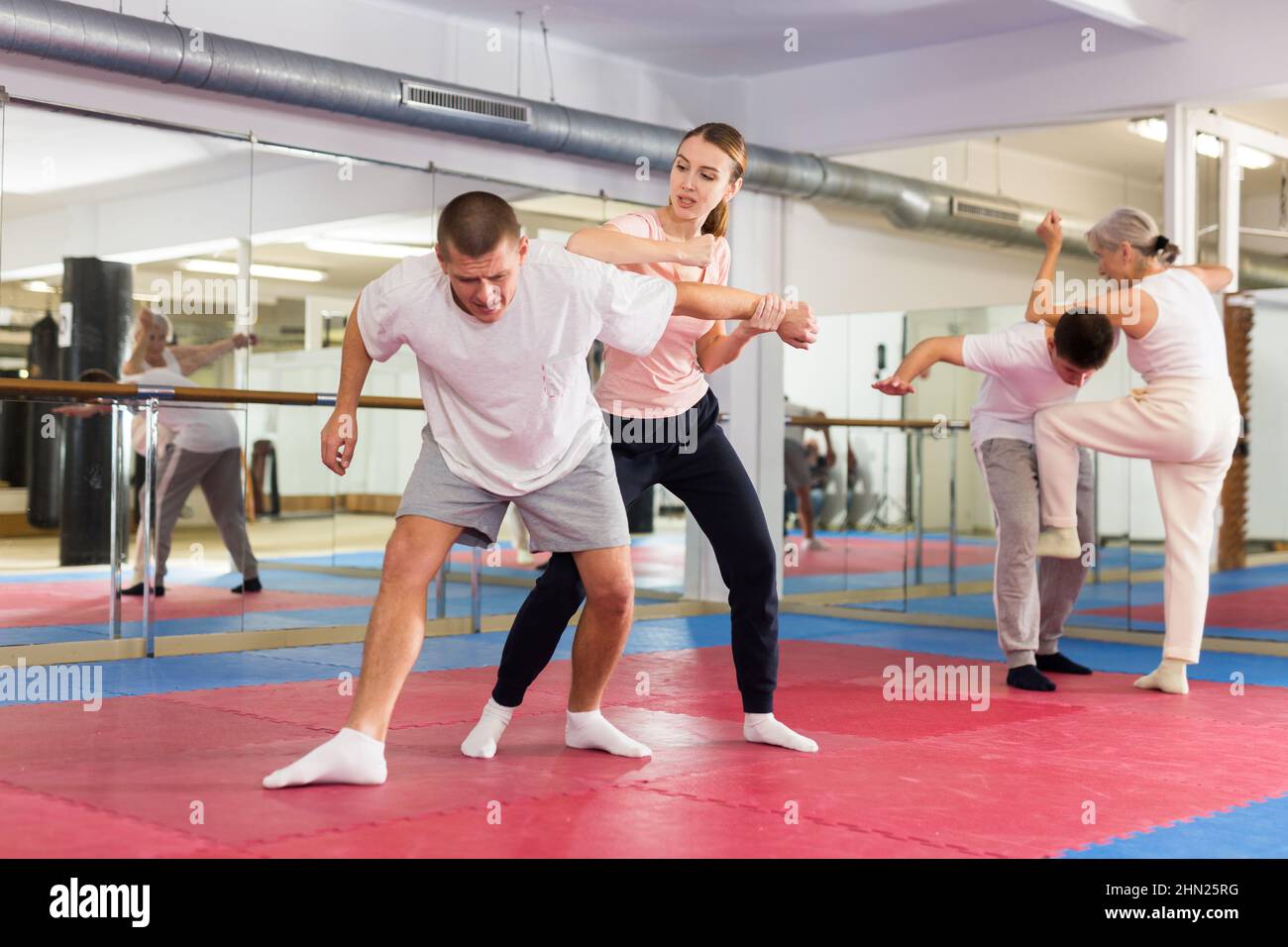 Woman performing elbow strike during self-defence training Stock Photo ...