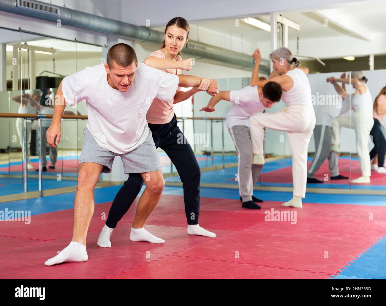 Woman performing elbow strike during self-defence training Stock Photo ...