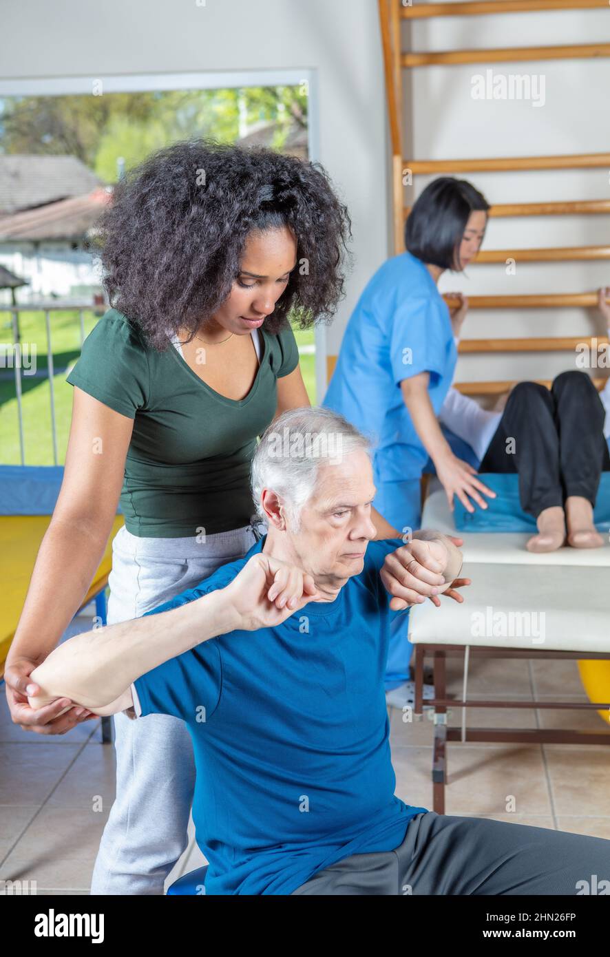 Elderly couple training gym helped hi-res stock photography and images ...