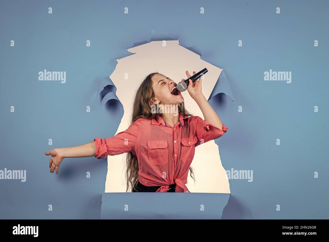 really inspired girl. vocal and music. cheerful kid with microphone ...