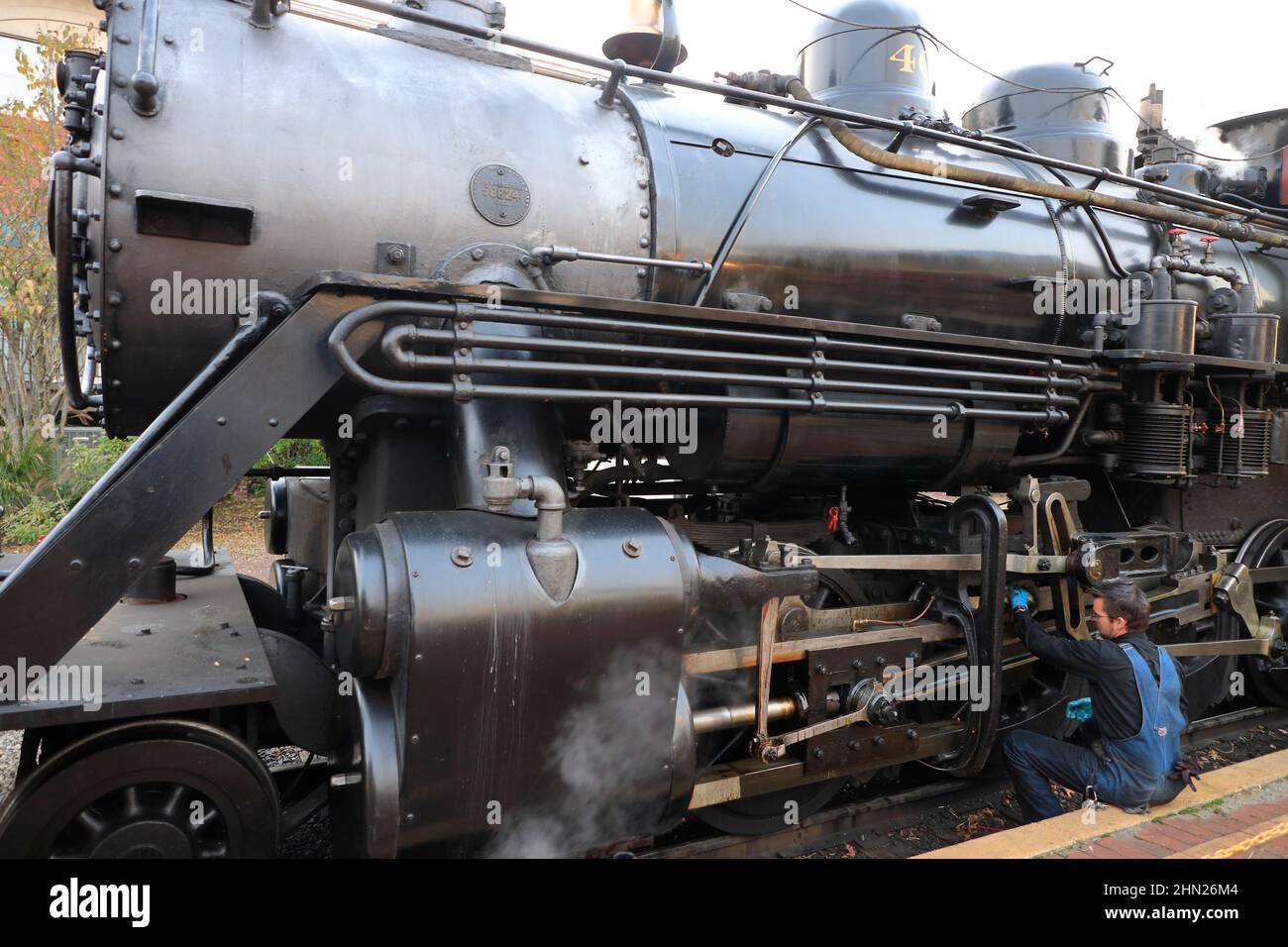 An engineer checking the antique steam locomotive in New Hope train ...