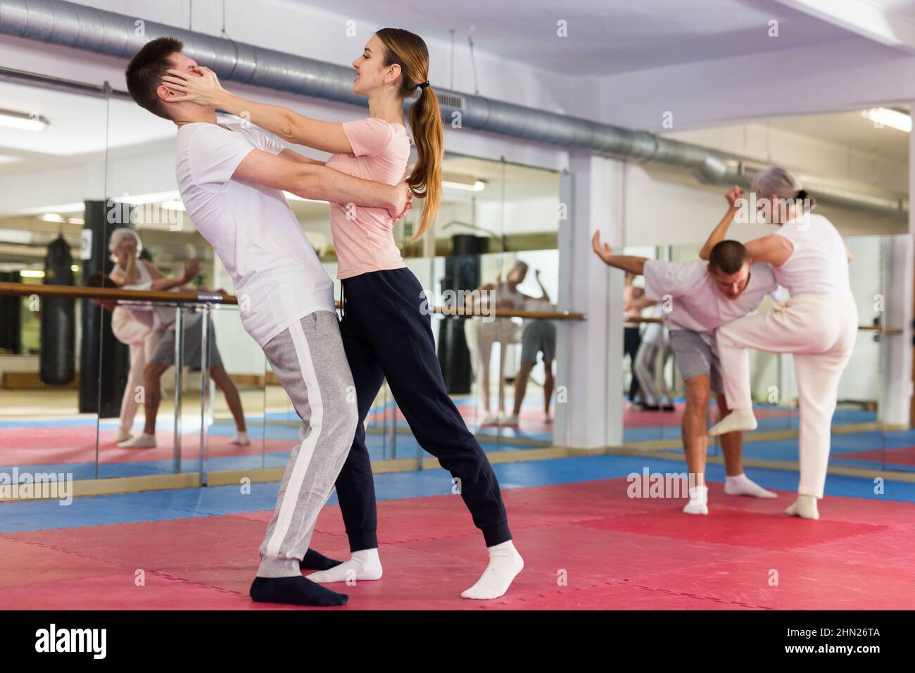 Woman performing eye-gouging move during self-defence training Stock ...