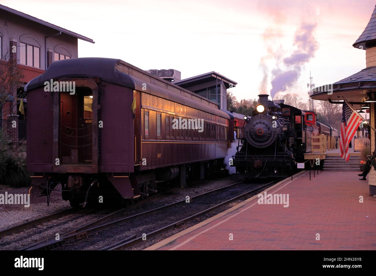 A train car passing a steam locomotive at New Hope Railroad Heritage ...