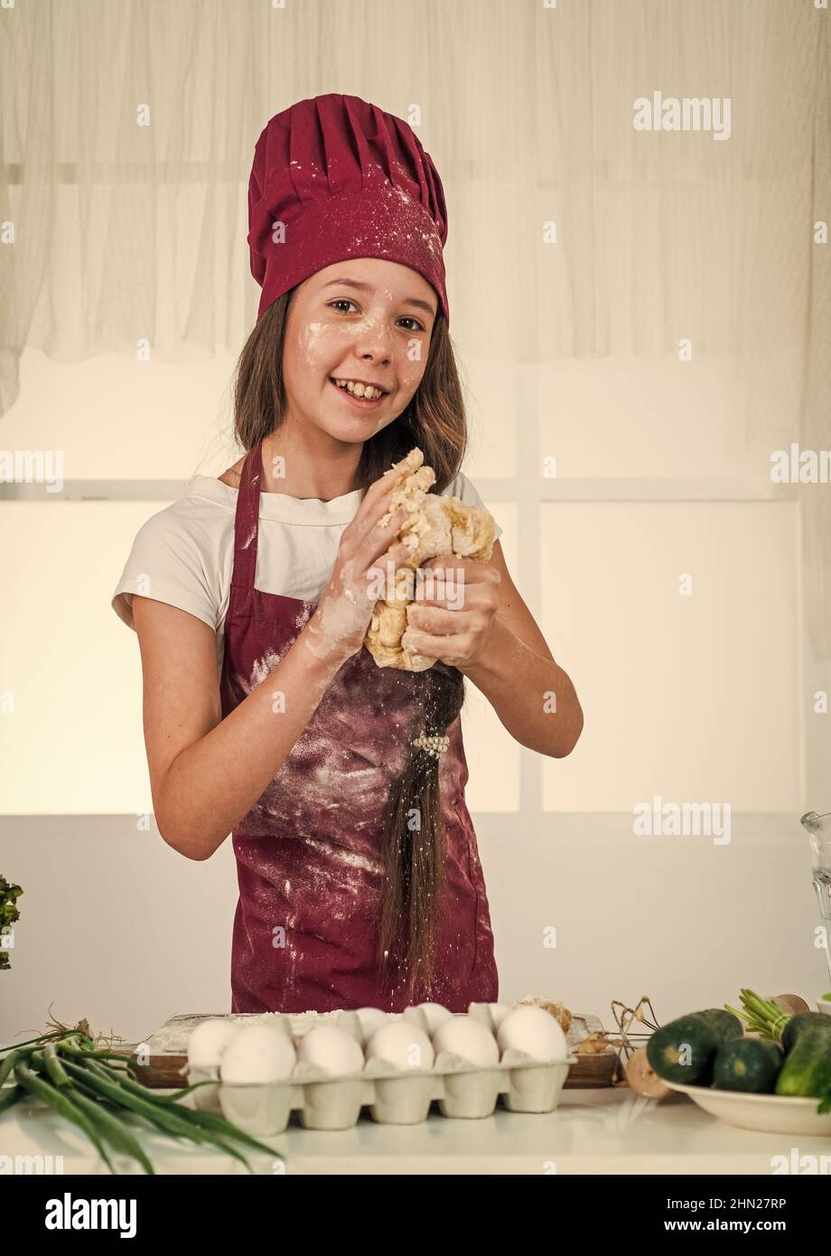 happy childhood. happy child wear cook uniform. chef girl in hat and ...
