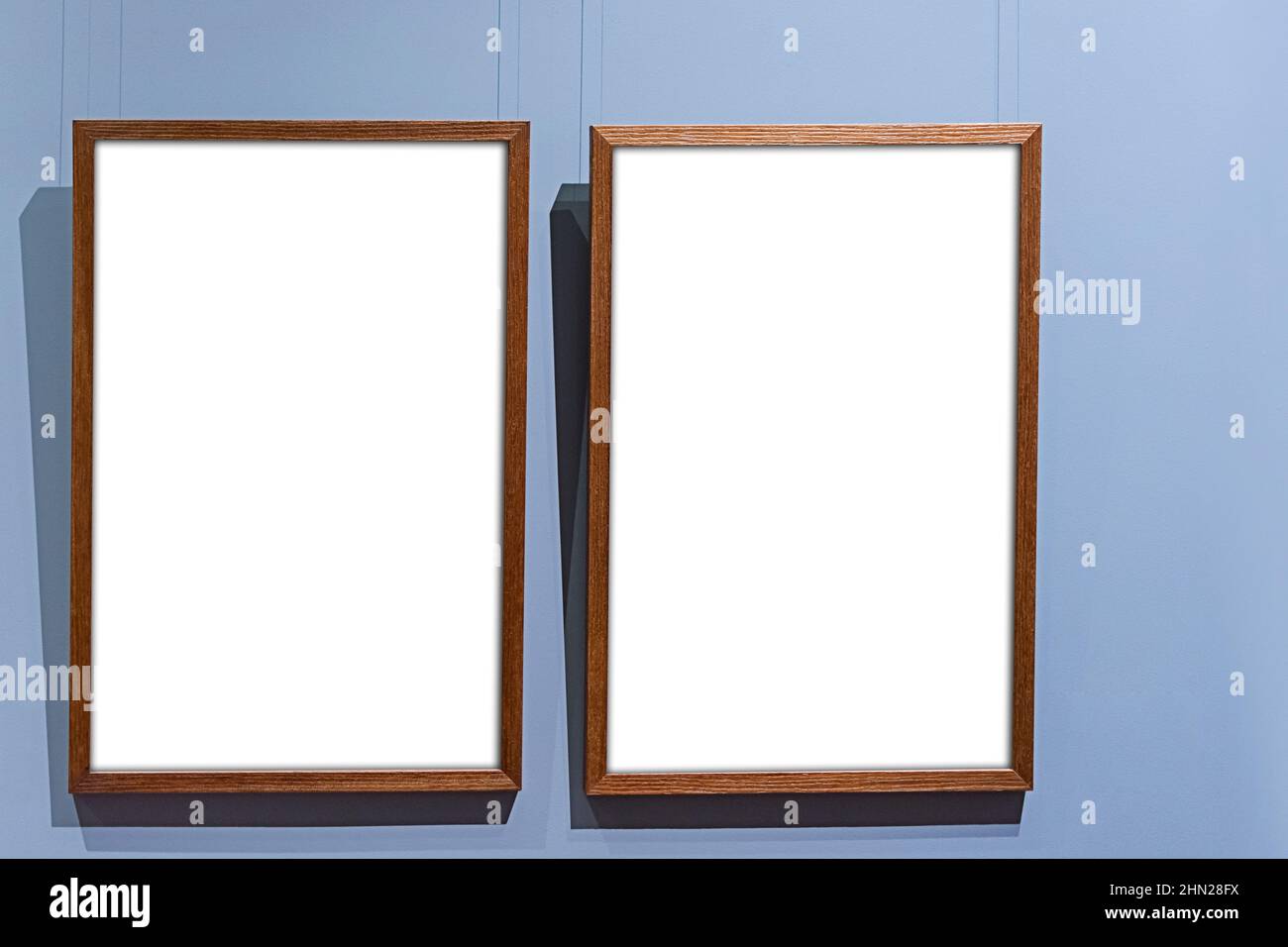 Gallery mock up two frame in interior blue wall Stock Photo - Alamy