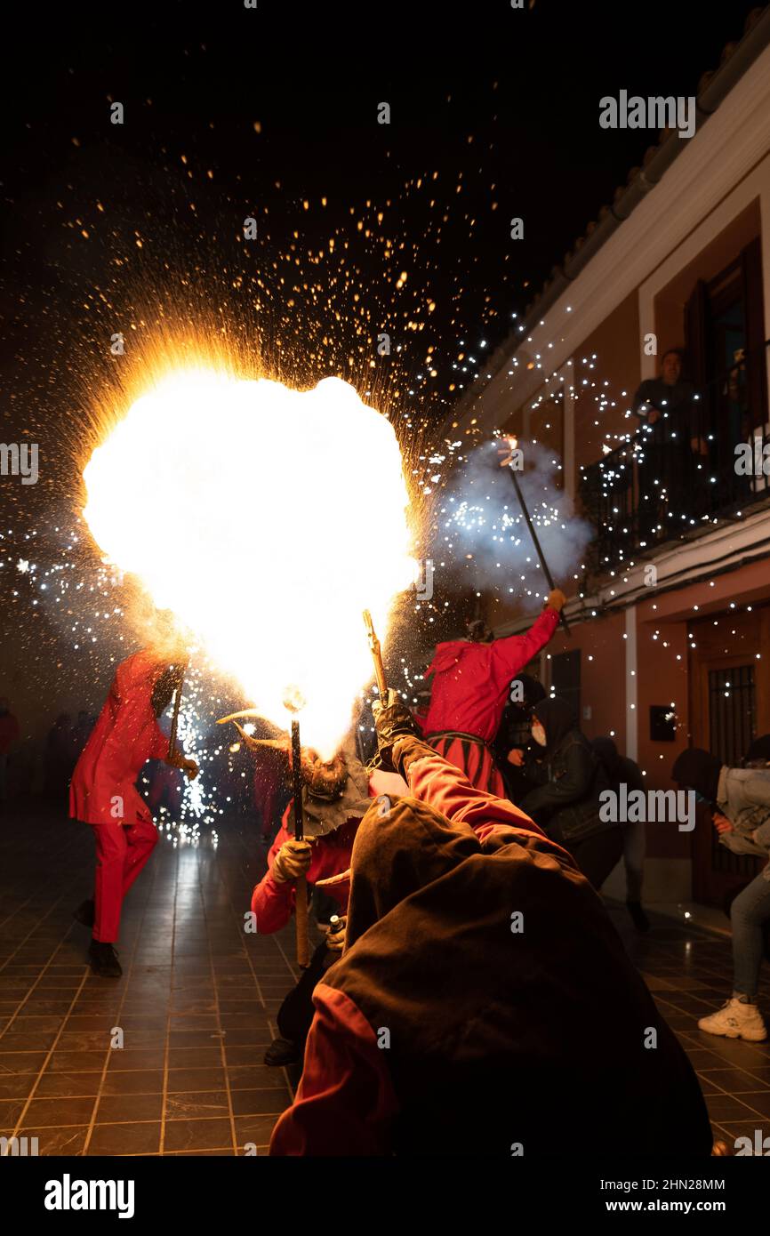 Valencia, Spain - 11 February, 2022: Man dressed as a demon spitting ...