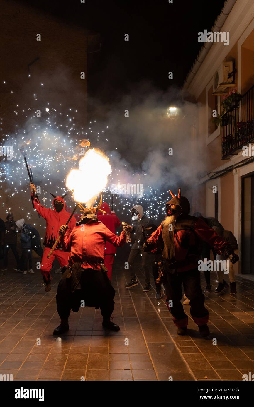 Valencia, Spain - 11 February, 2022: Man dressed as a demon spitting ...