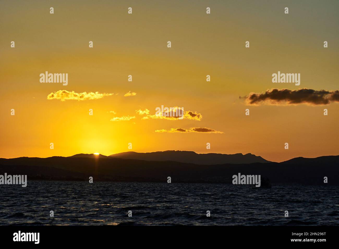 Sunset on the mountainous coast of Crete island in Greece Stock Photo ...