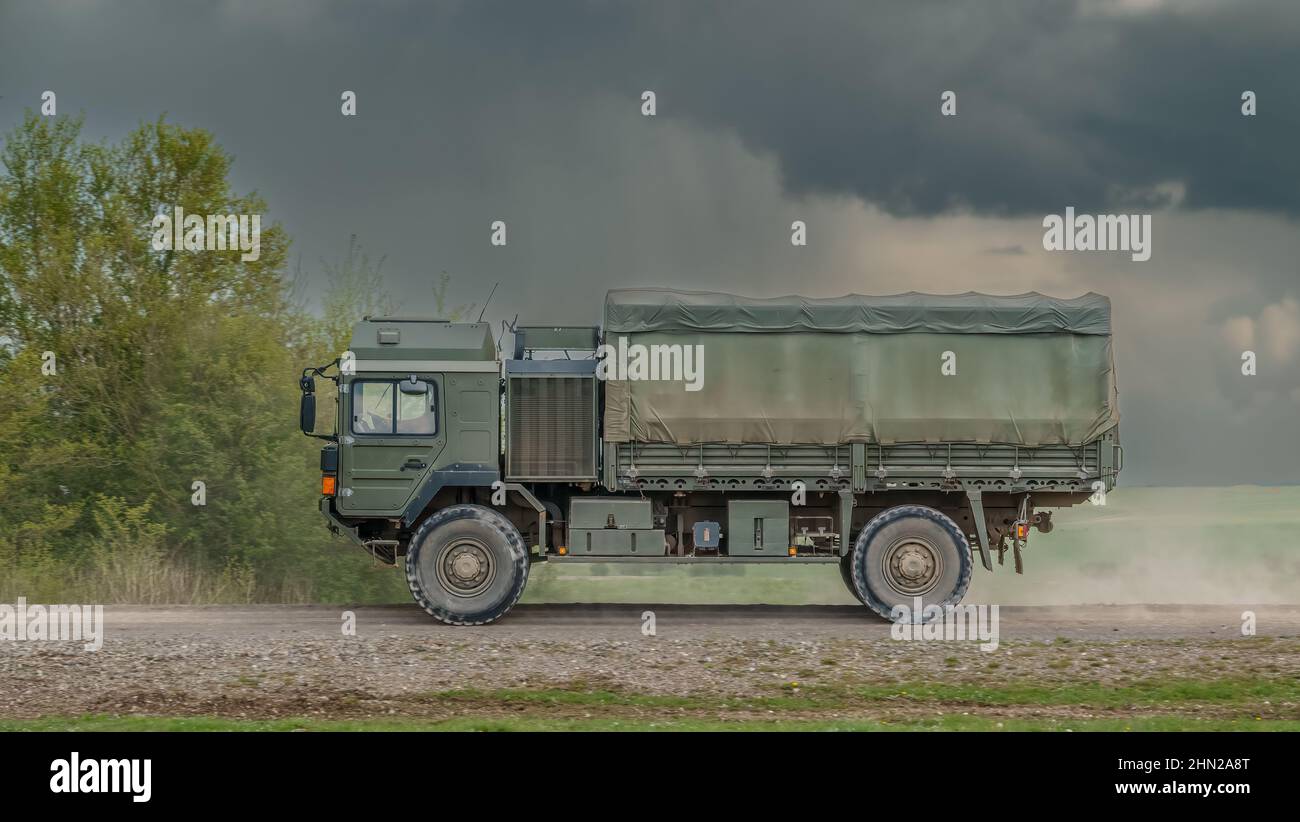 british army MAN SV 4x4 lorry logistics vehicle truck driving along a ...