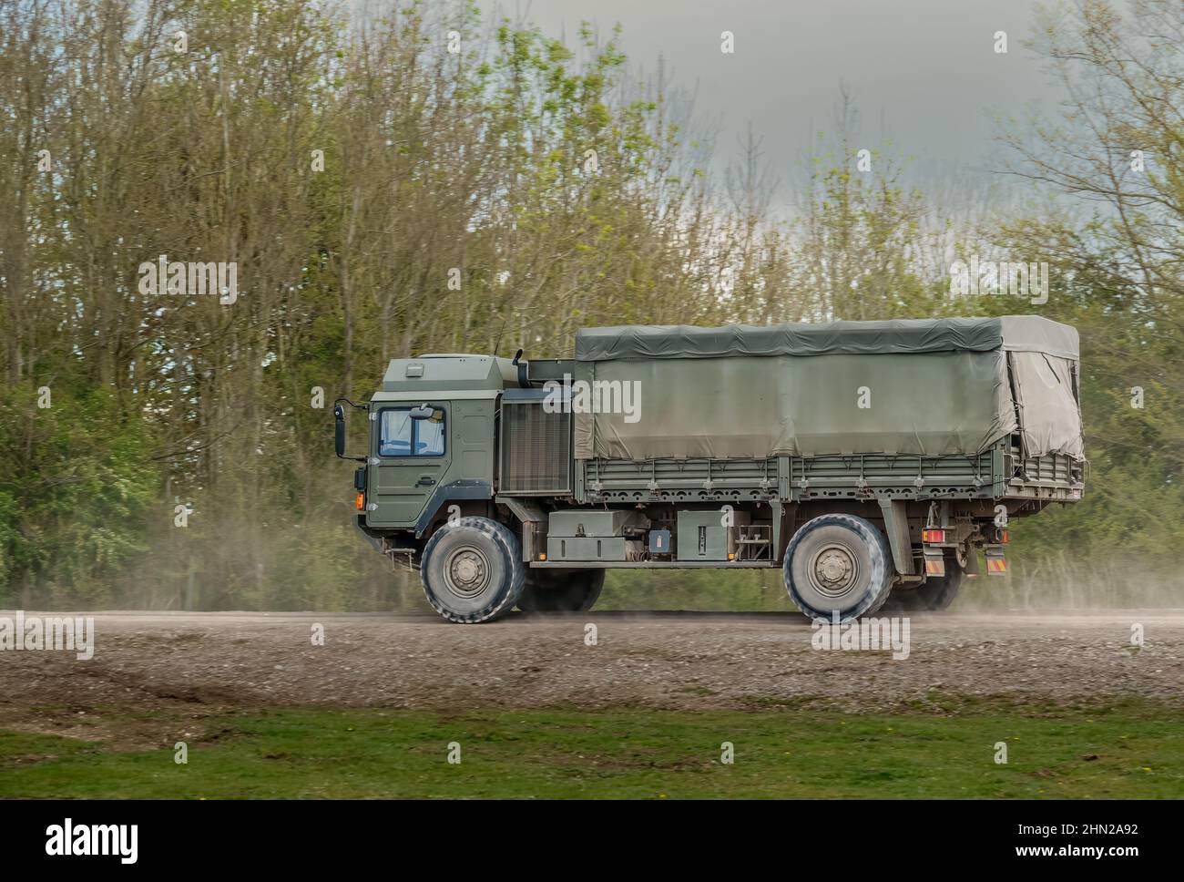 british army MAN SV 4x4 lorry logistics vehicle truck driving along a ...