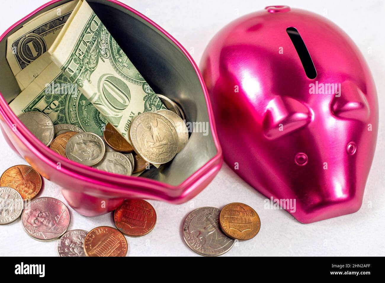 Bright pink pig money box for coins on light background. Economy ...