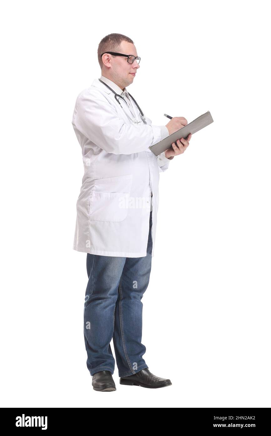 Side view of concentrated male doctor writing reports Stock Photo - Alamy