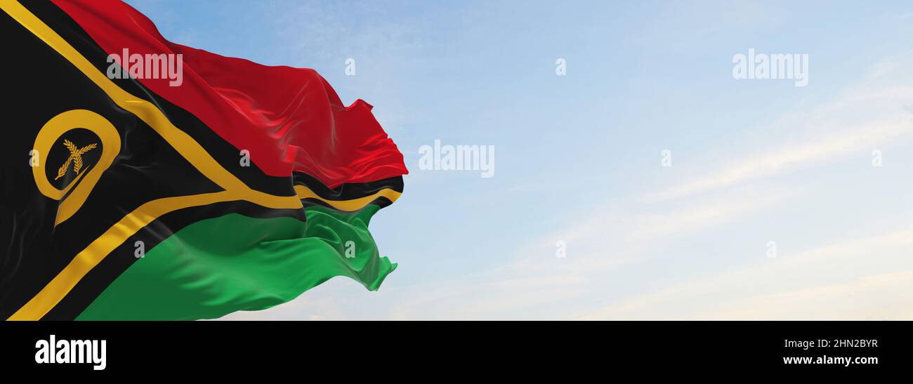 official flag of Vanuatu at cloudy sky background on sunset, panoramic ...