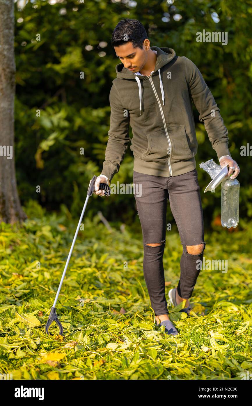 Volunteer conserving environment from pollution and plastic Stock Photo ...