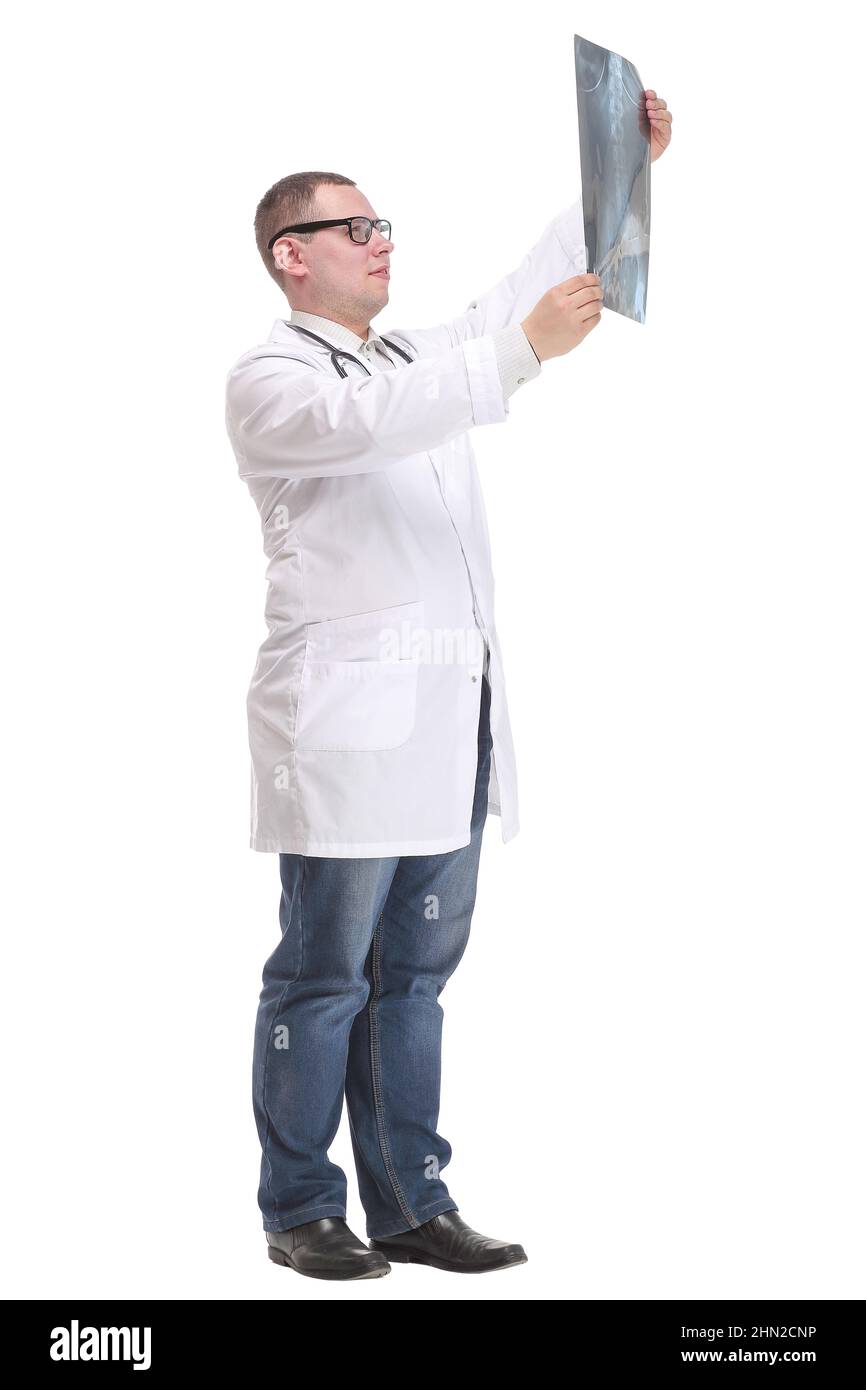 Side view of attractive doctor examining an x-ray and looking at the ...