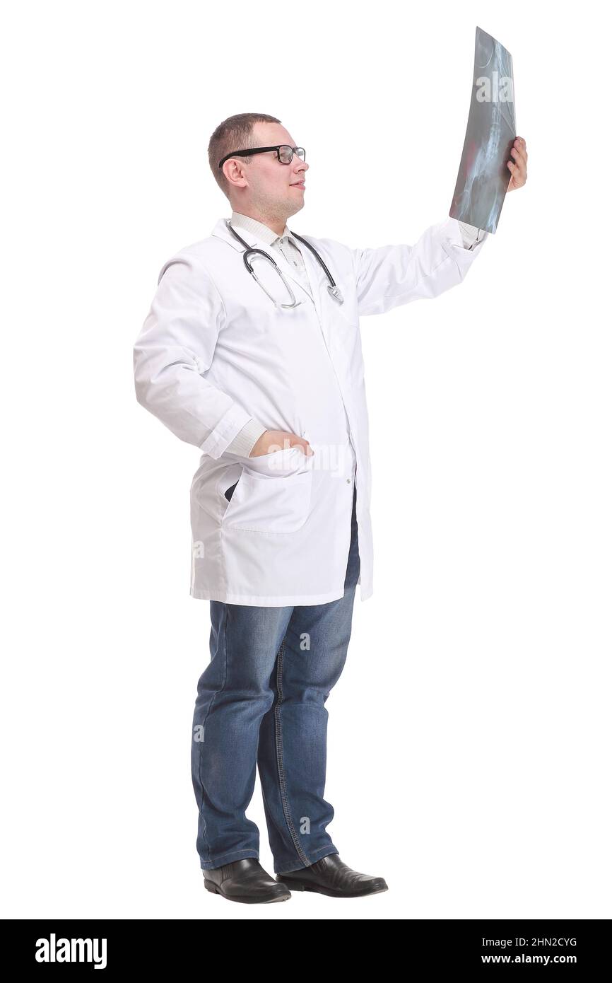 Side view of attractive doctor examining an x-ray and looking at the ...