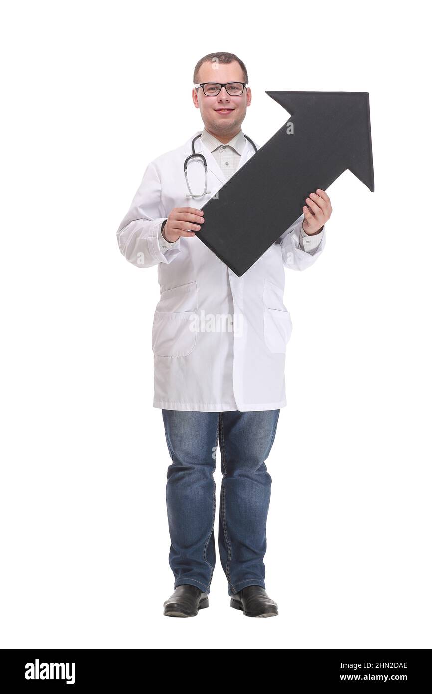 Front view of young smiling doctor holding a black arrow pointing right ...