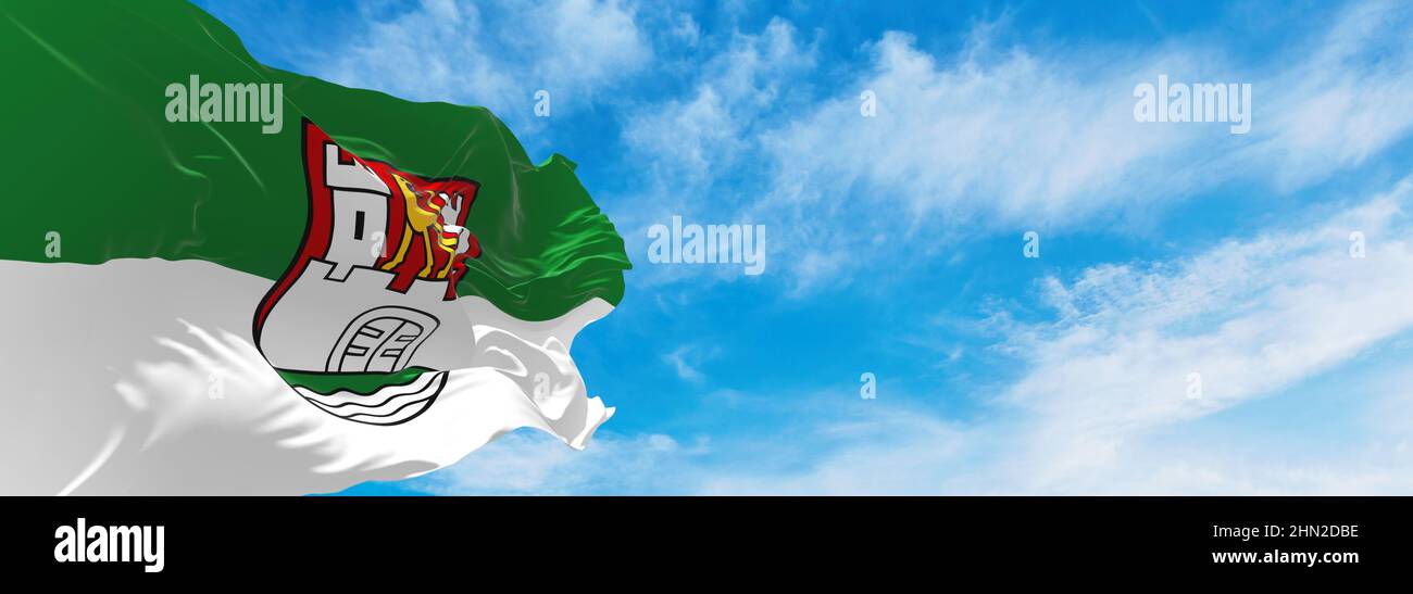 flag of Wolfsburg at cloudy sky background on sunset, panoramic view ...