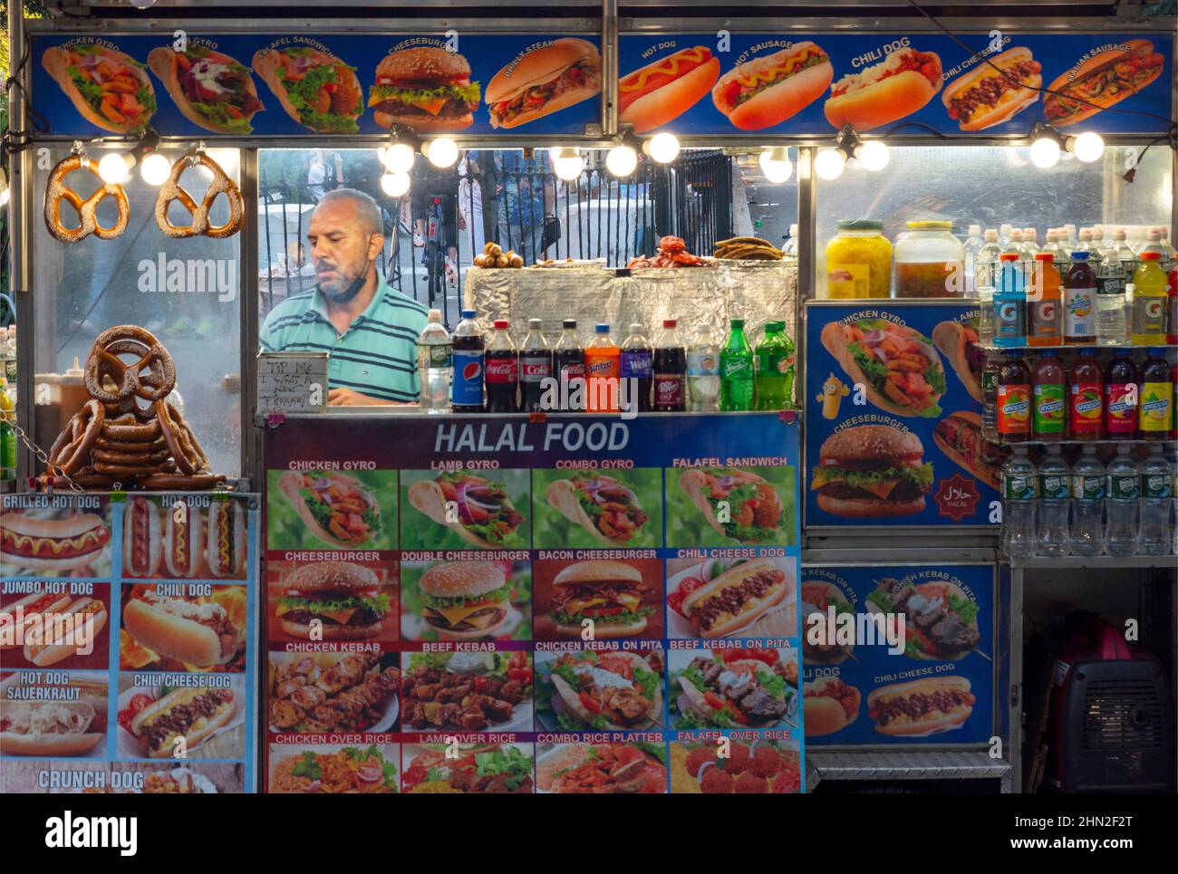 man in a Halal food cart vendor in lower Manhattan NYC Stock Photo - Alamy
