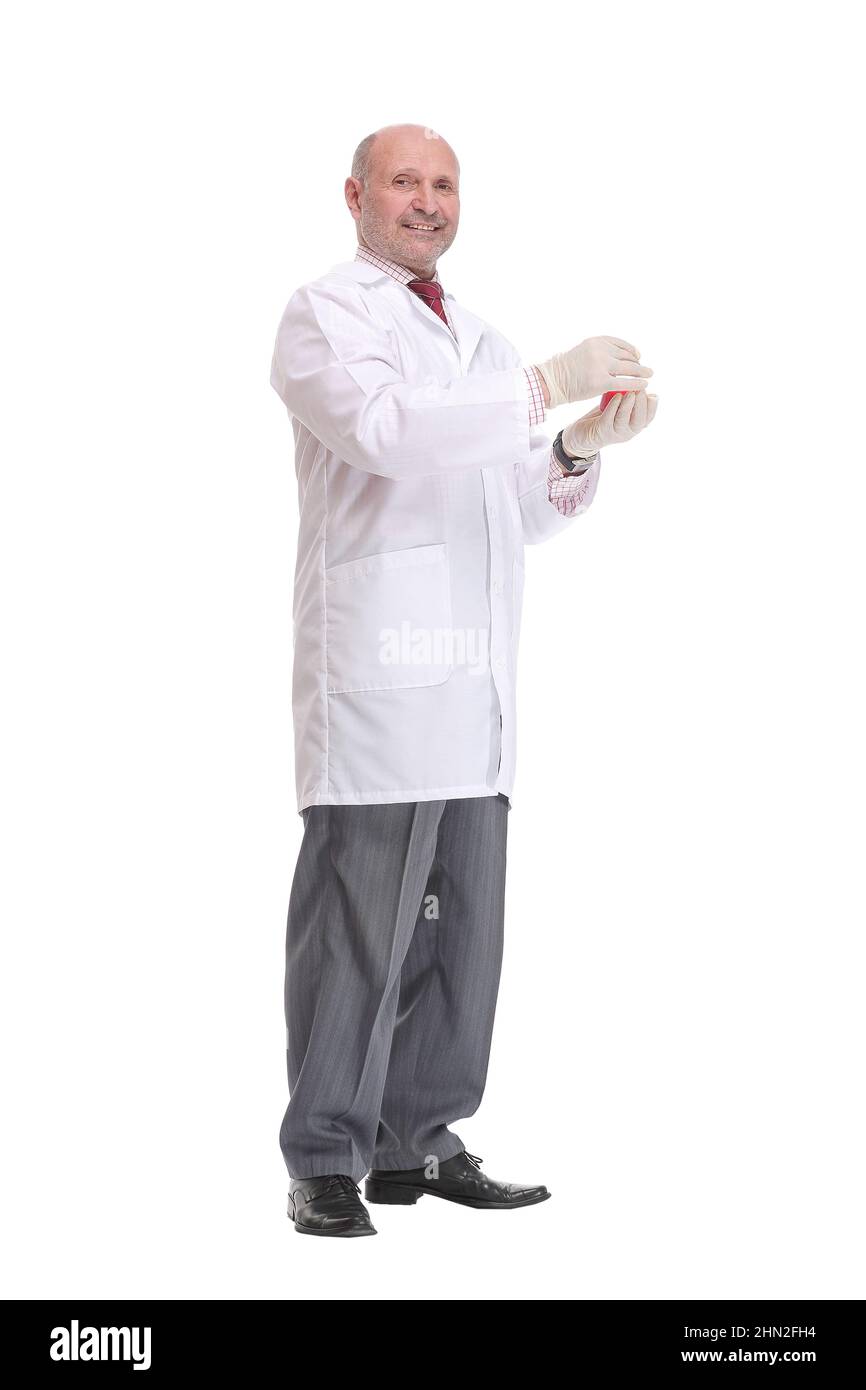 Mature scientist with grey hair and beard in white coat standing with ...