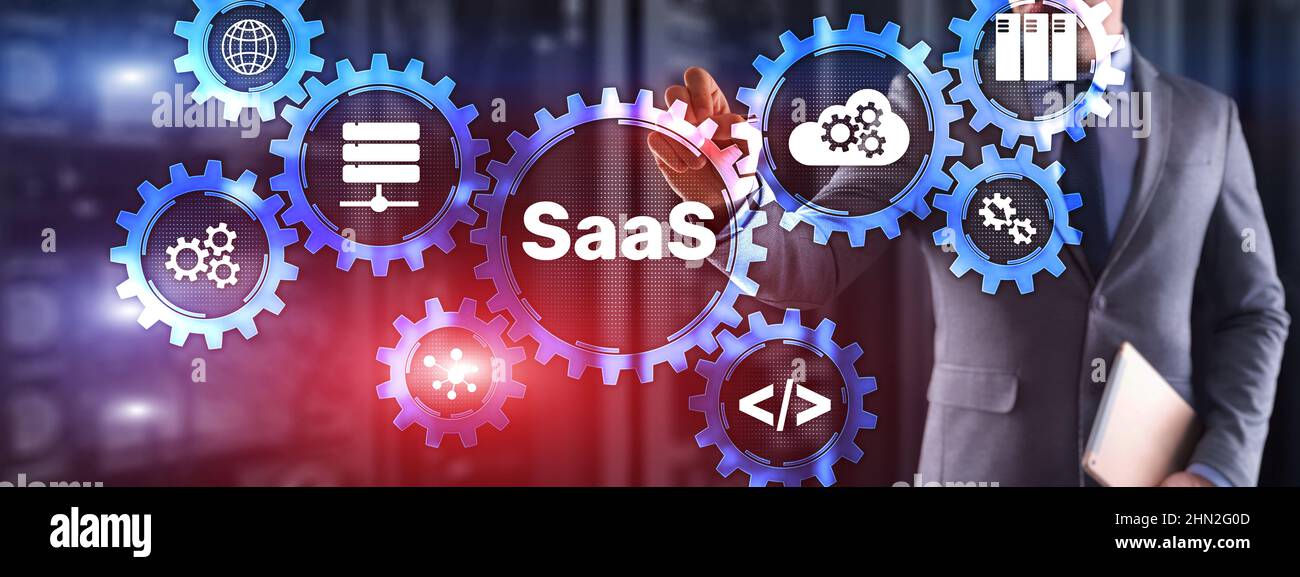 SaaS Software as a Service concept with hand pressing text Stock Photo - Alamy