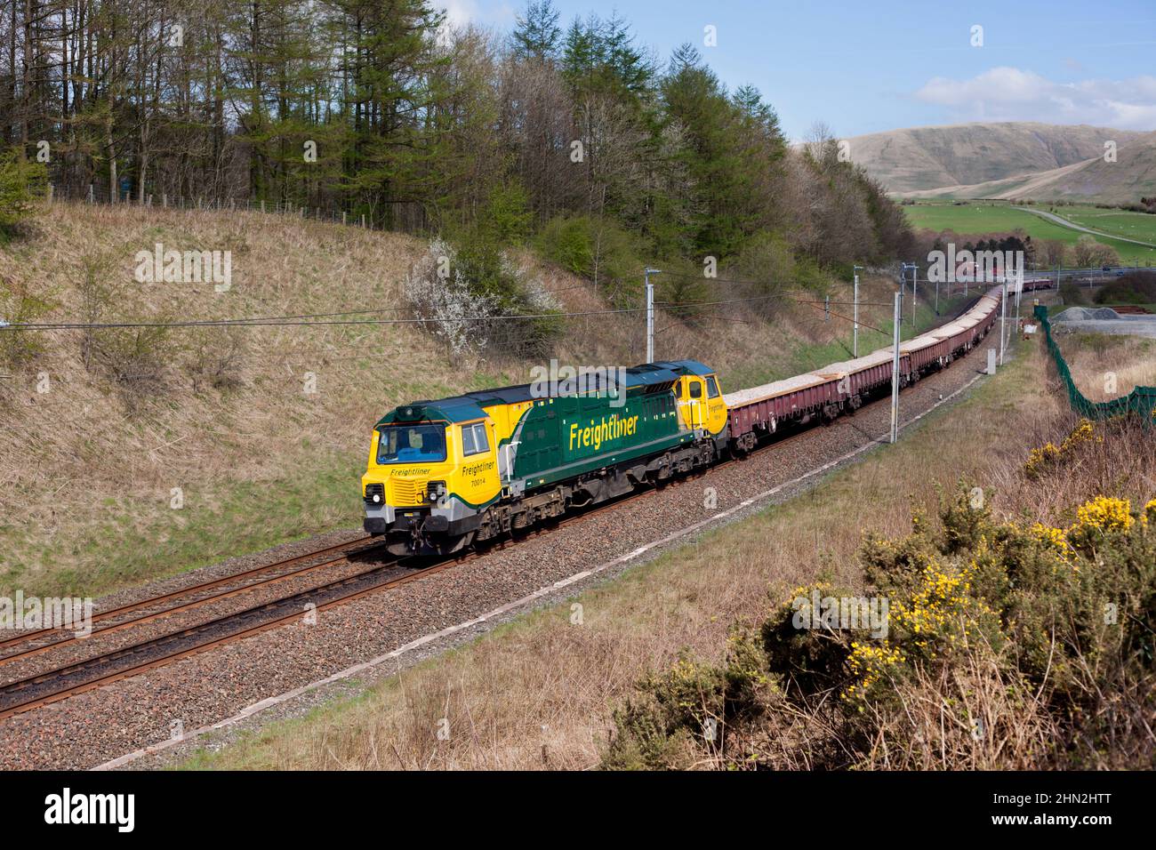 Freightliner class 70 diesel locomotive in the Cumbrian countryside on ...