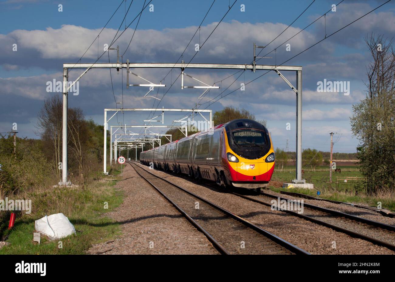 Virgin Trains Alstom Pendolino train passing Astley on the Chat moss ...