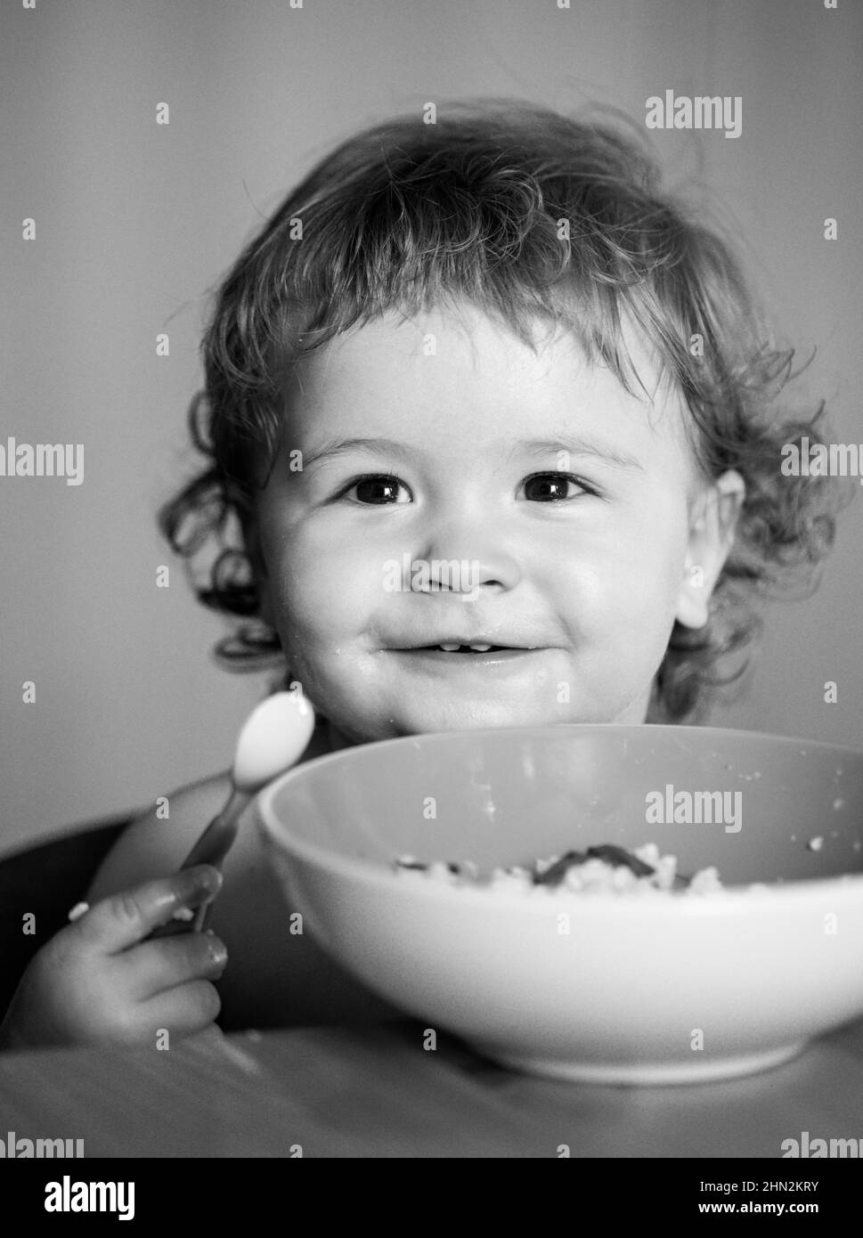 Hungry child and plate Black and White Stock Photos & Images - Alamy