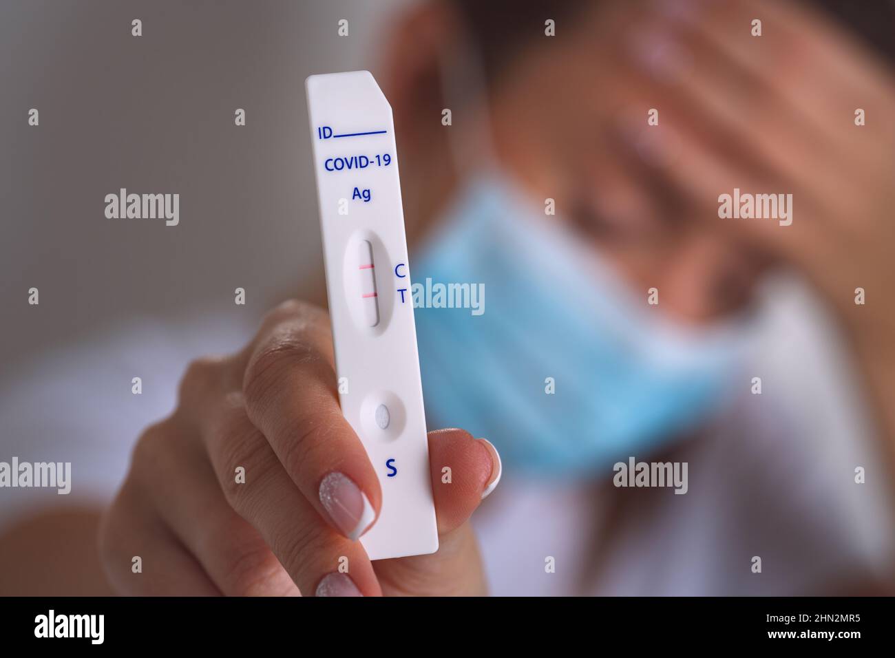 Sick infected woman showing rapid covid antigen test or express covid ...