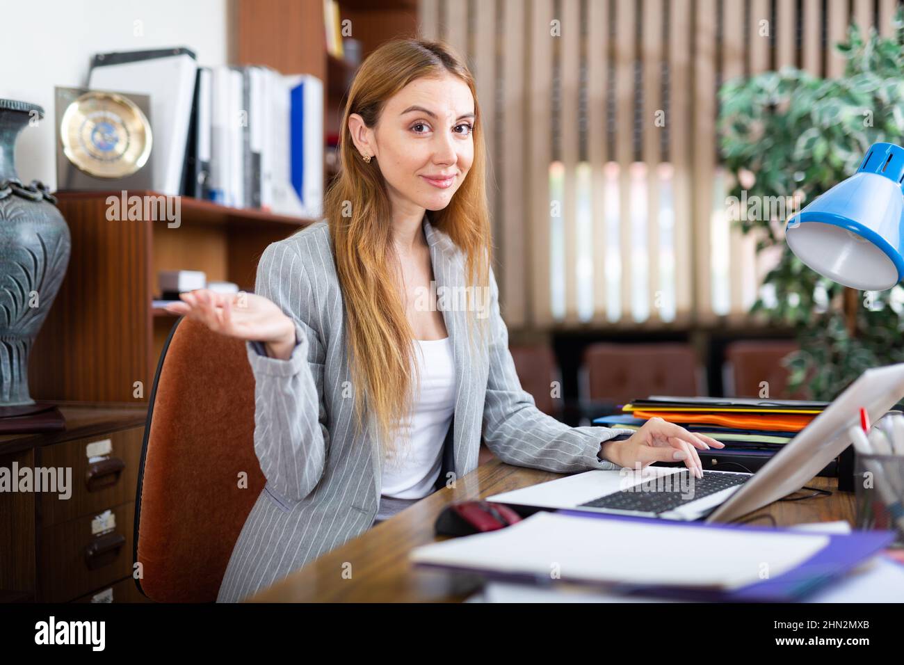 Young confident businesswoman works at a computer in the office Stock ...