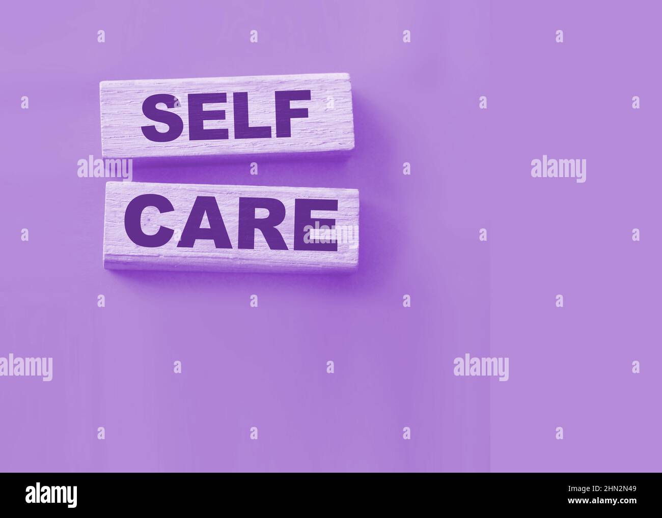 SELF CARE - text on wooden cubes on a red gradient background Stock ...