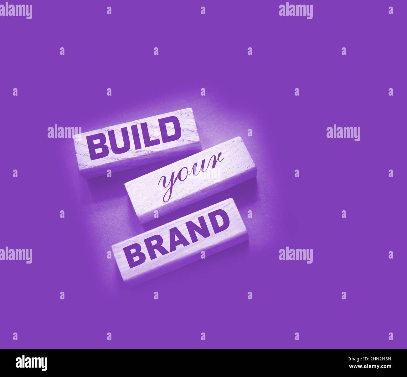 Phrase BUILD YOUR BRAND written on wooden blocks. With vintage styled ...