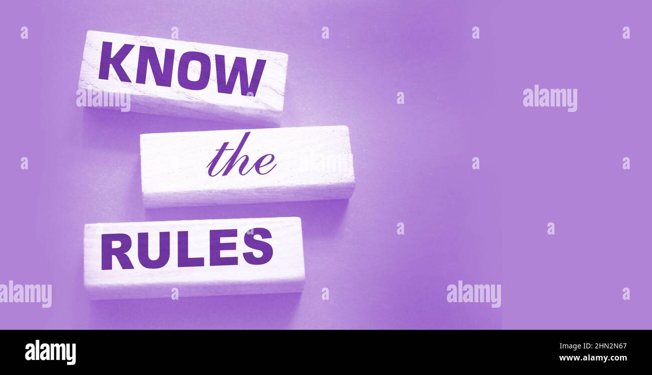 Know the rules word on wooden blocks isolated on dark grey background ...
