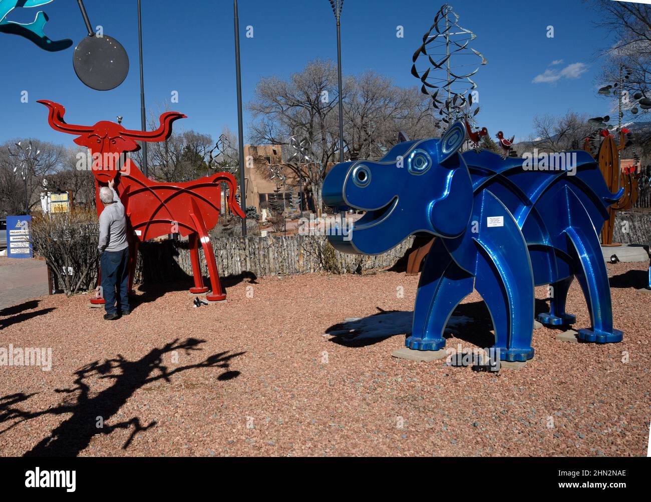 Tourists admire large steel sculptures of animals by artist Fredrick ...