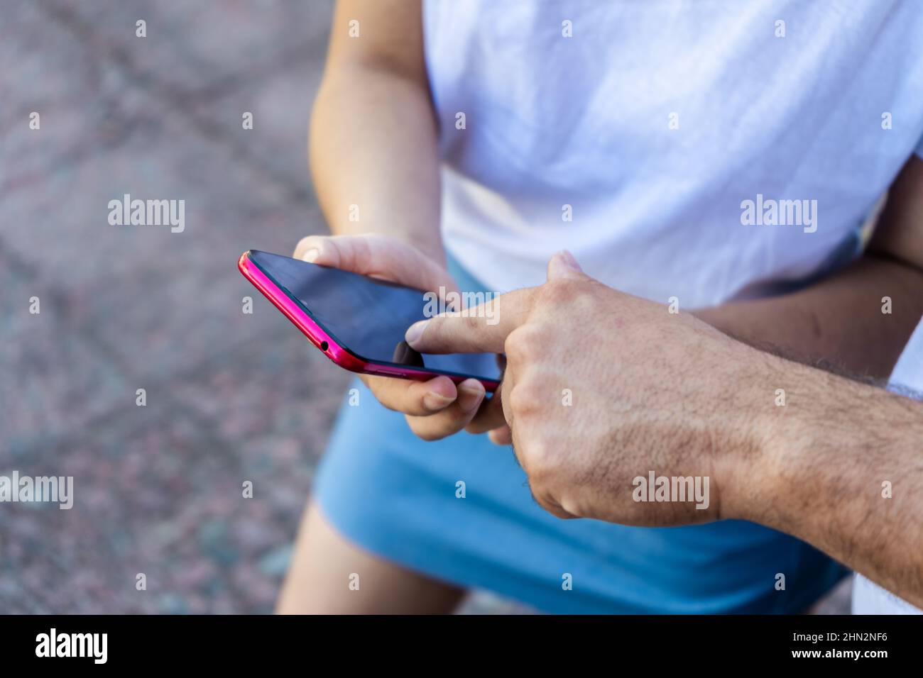 Checking messages while walking hi-res stock photography and images - Alamy
