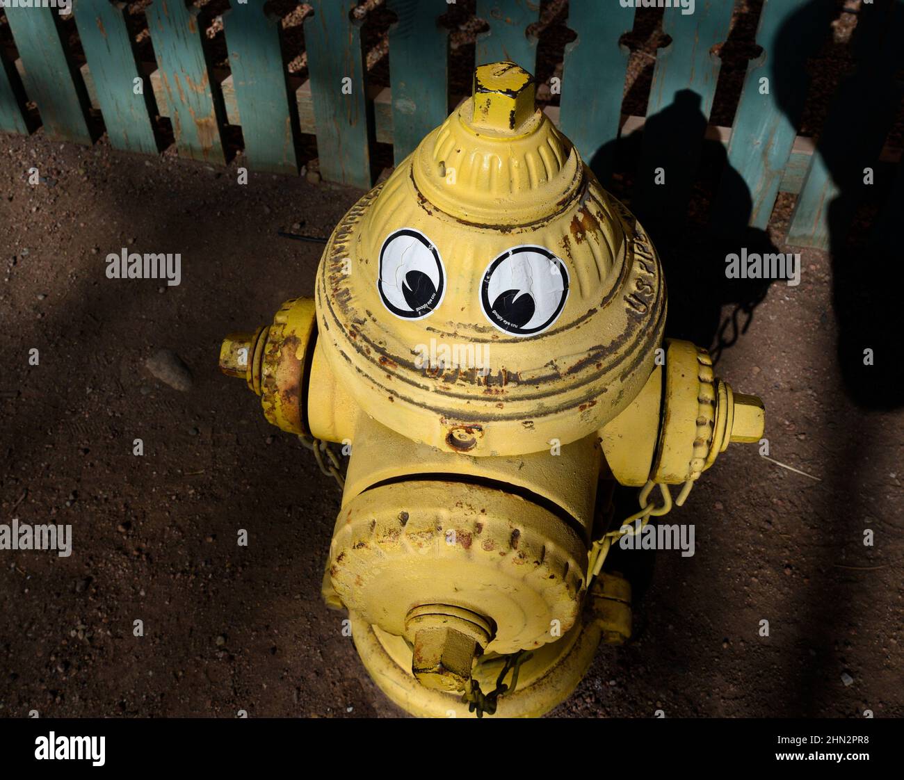 A yellow fire hydrant with humorous decal eyes applied in Santa Fe, New ...