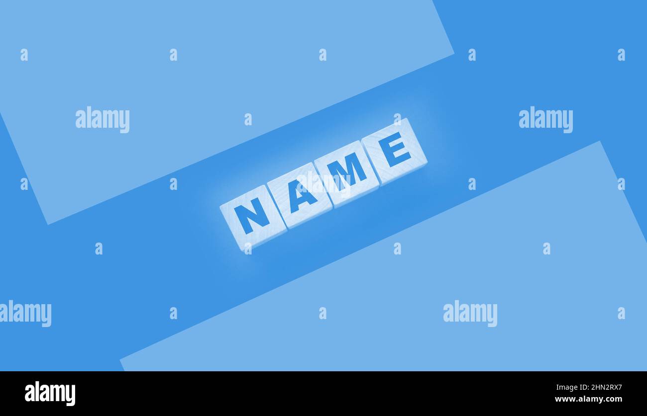 Name word with wooden block on black blackboard. Business or personal ...