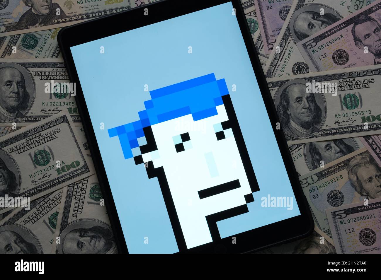 NFT Cryptopunk 5822 form Larva Labs seen on the screen of ipad placed ...