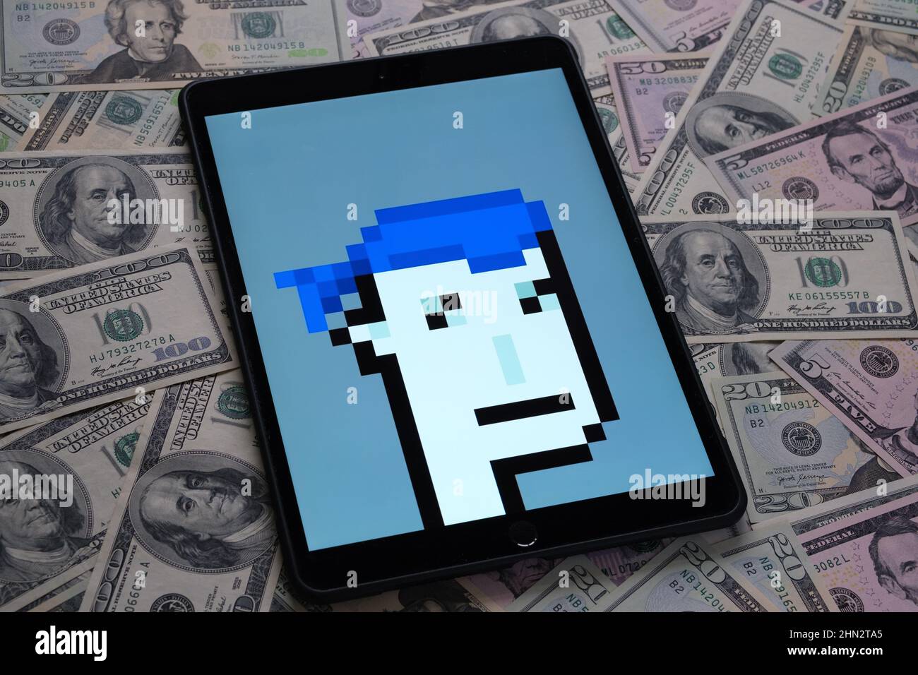 NFT Cryptopunk 5822 form Larva Labs seen on the screen of ipad placed ...