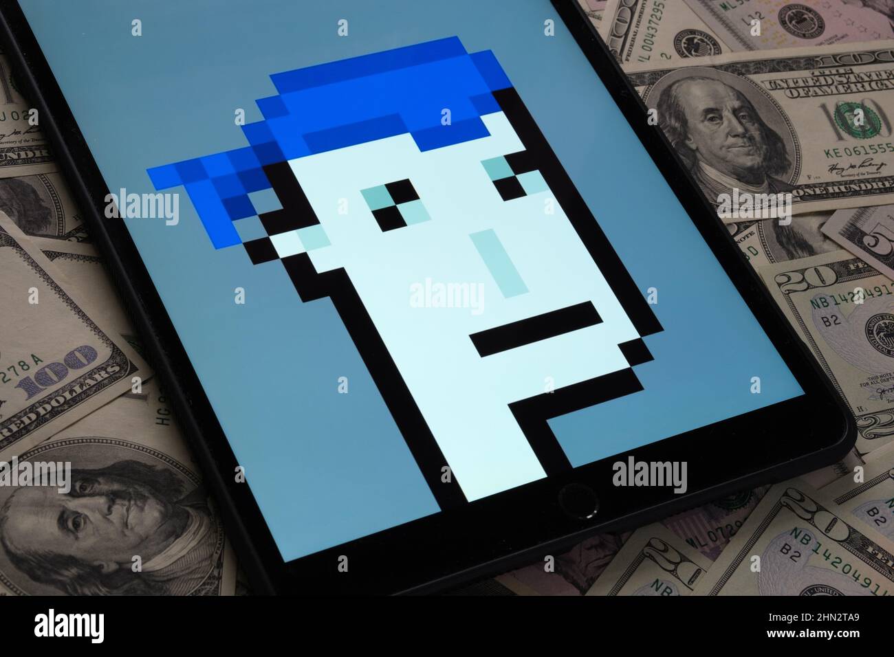 NFT Cryptopunk 5822 form Larva Labs seen on the screen of ipad placed ...